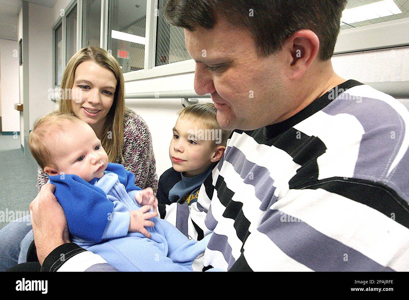 Jonah Pierson is surround by his parents, Tony and Cara along with his ...