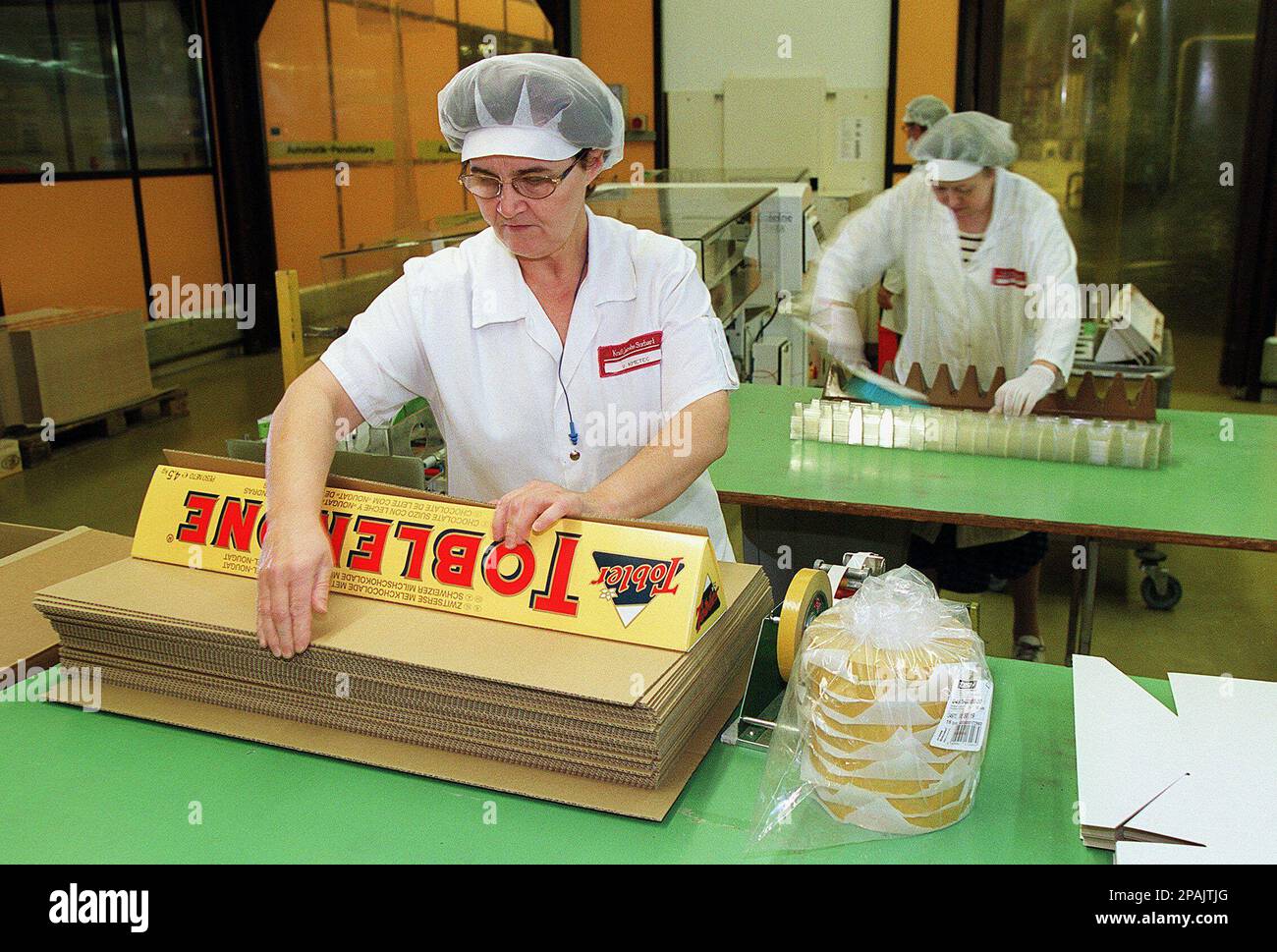 ** FILE ** An employee wraps a giant Toblerone chocolate bar at the ...