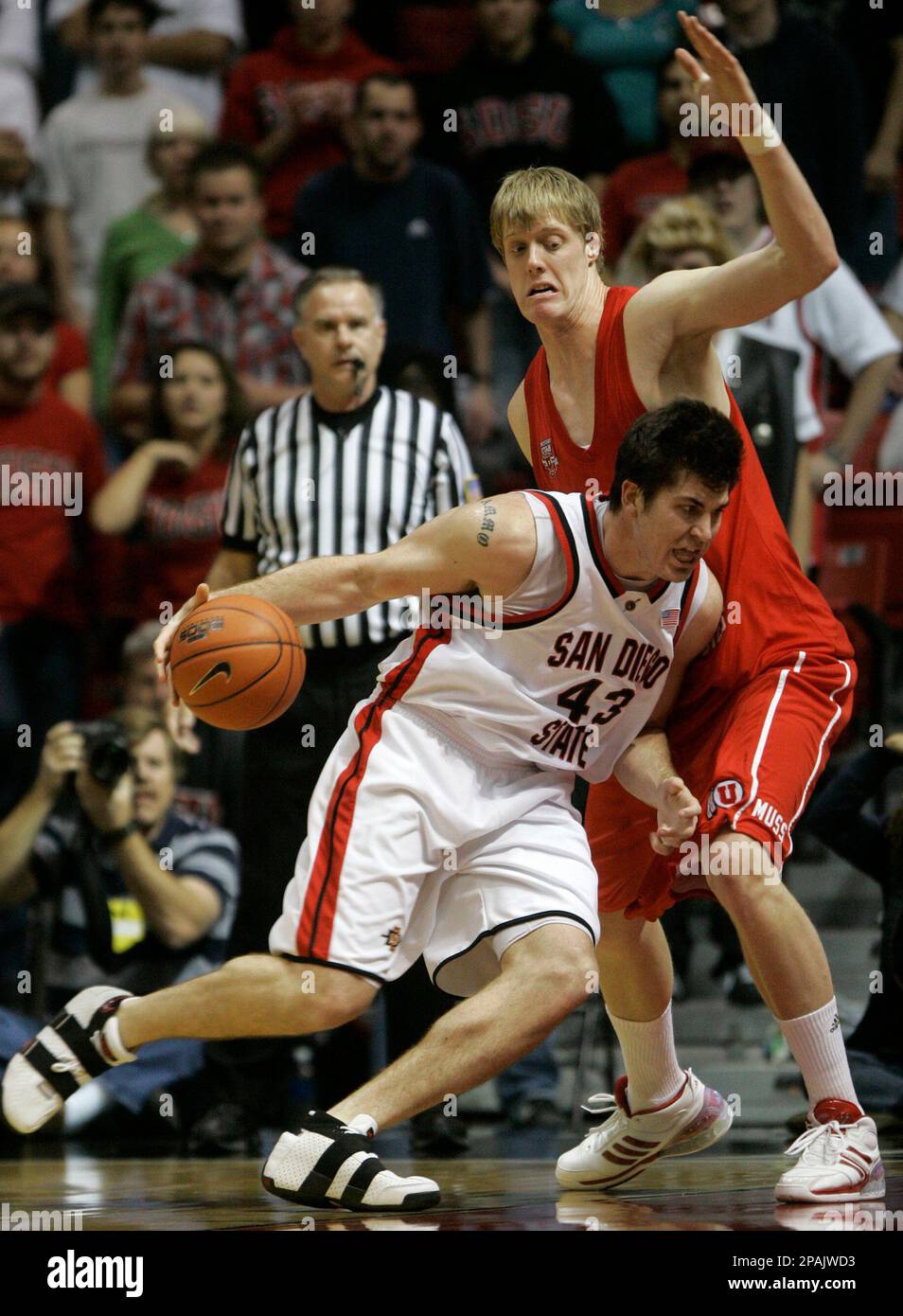 San Diego State's Ryan Amoroso drives against Utah's Luke Nevill during ...