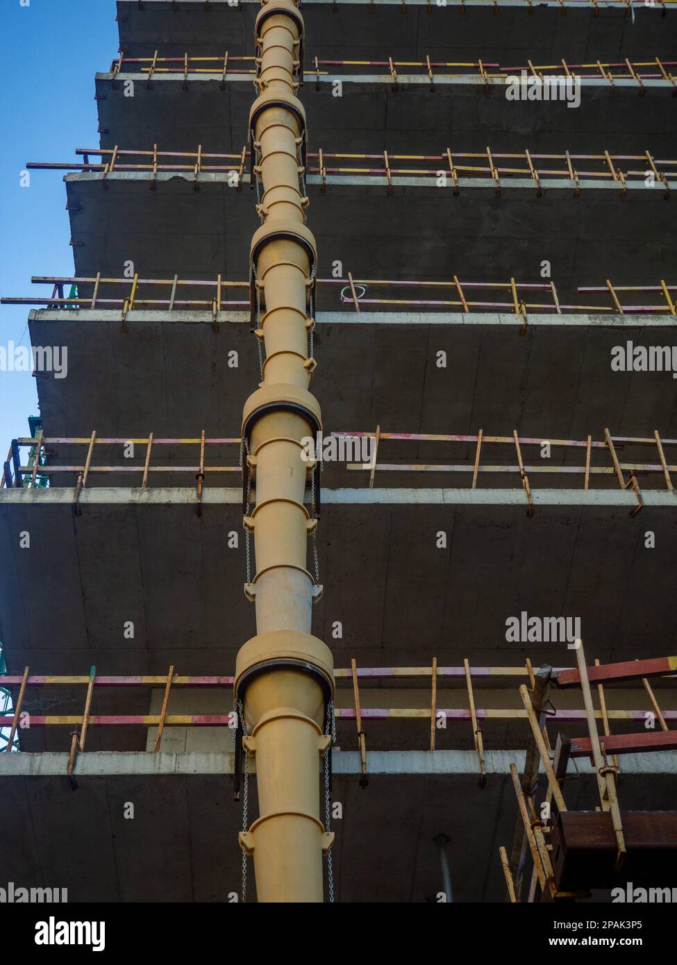 Sleeve for dumping debris at a construction site Down up. View from ...