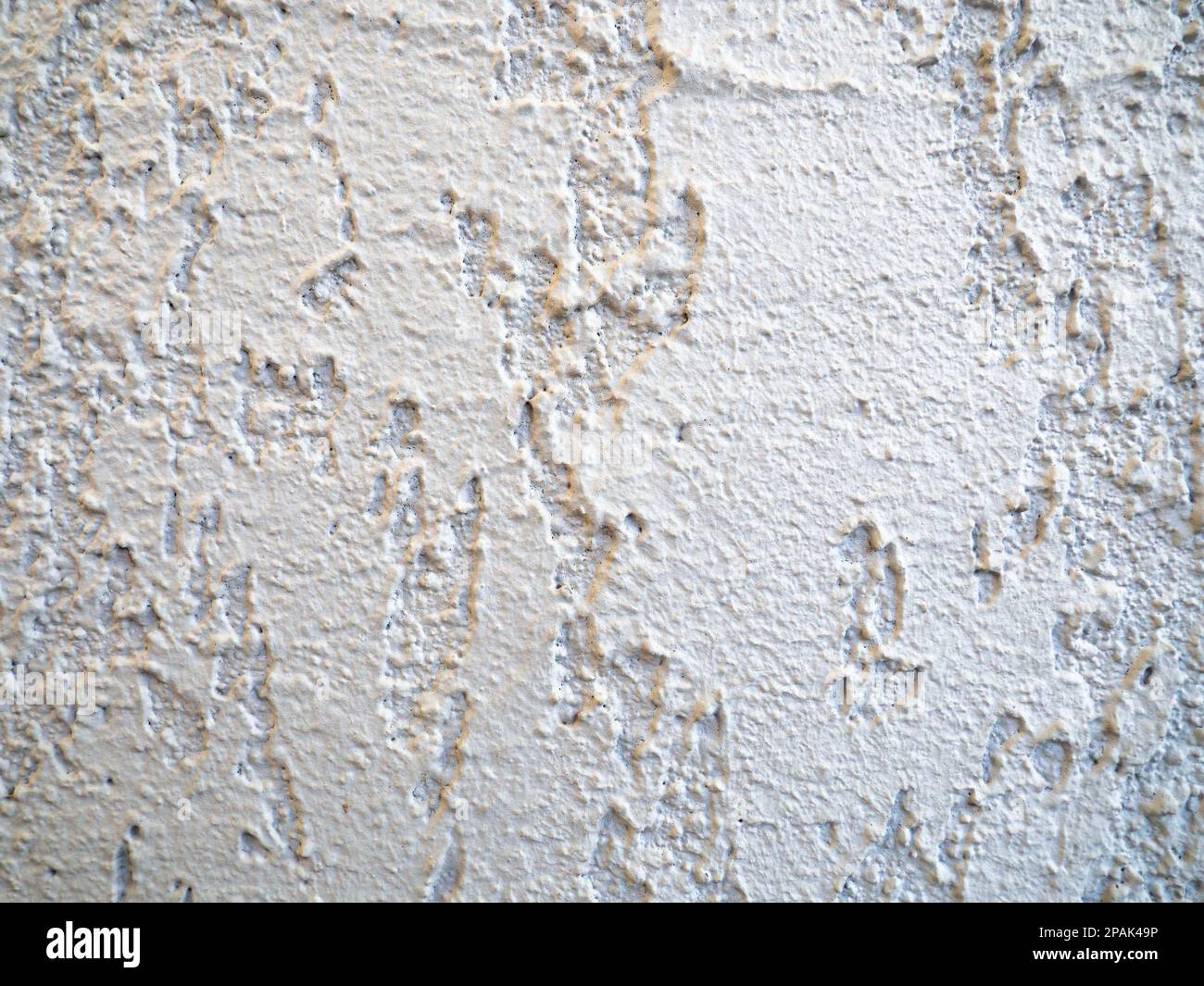 Rough light surface. Background from a stone wall. Cement stains. House ...