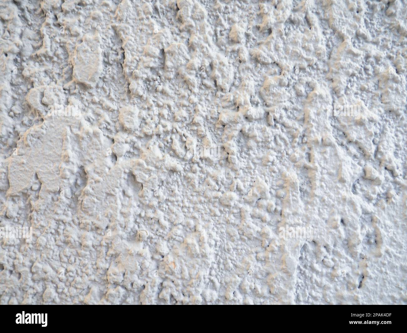 Rough light surface. Background from a stone wall. Cement stains. House ...