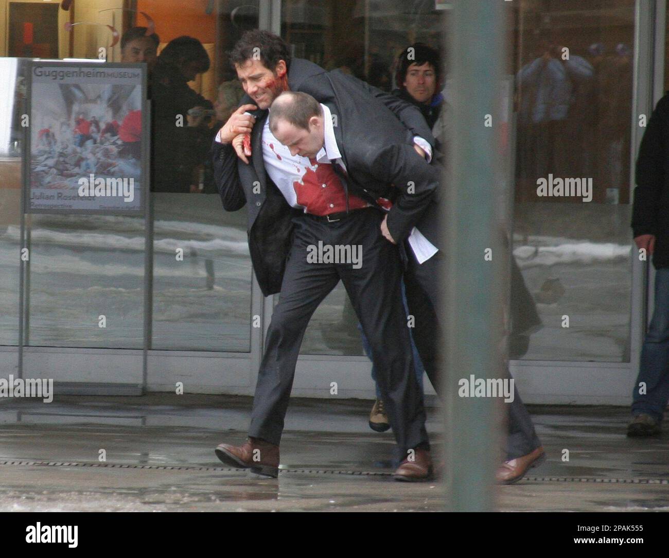Actor Clive Owen, left, helps actor Brian O' Byrne out of the ...