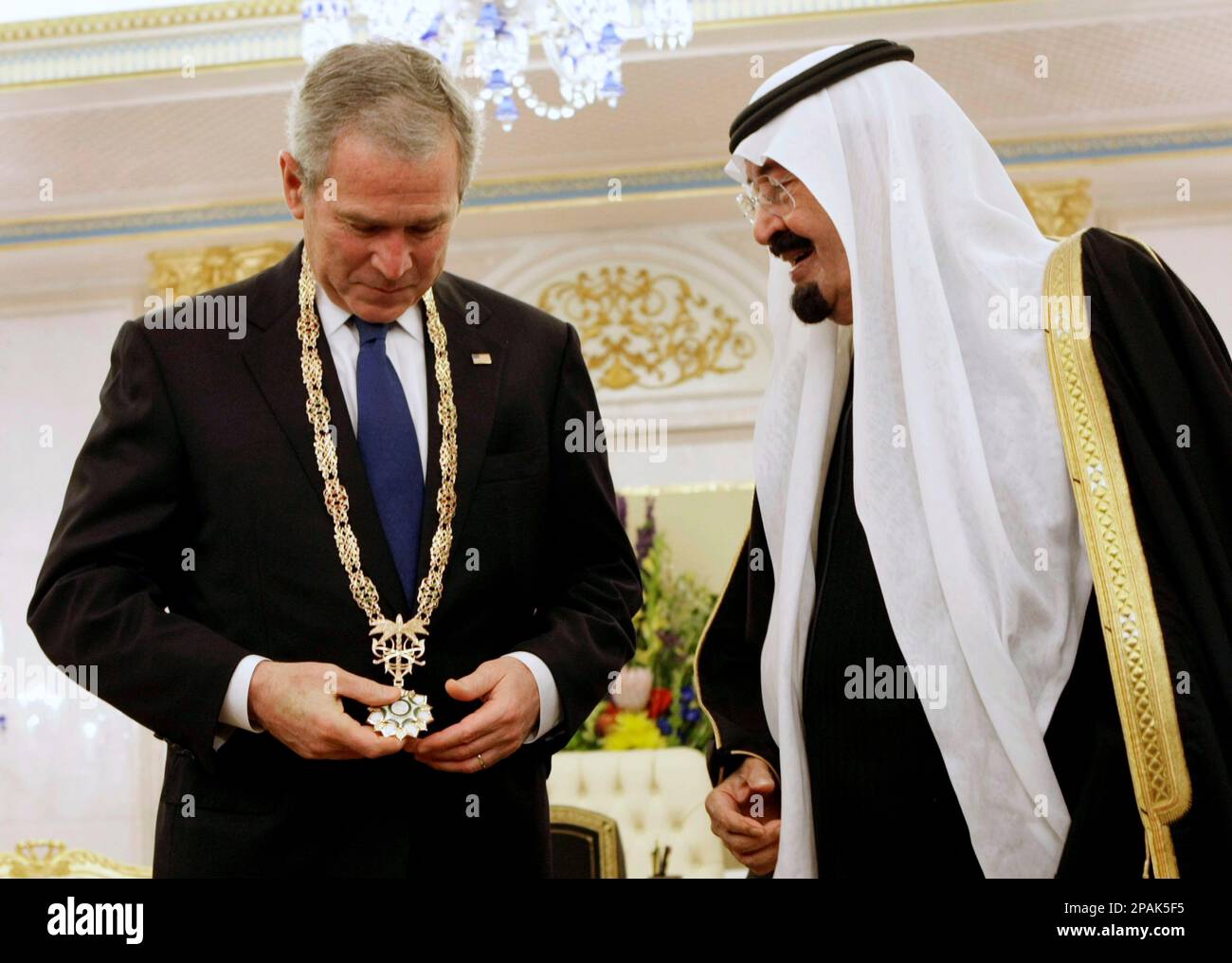 Saudi King Abdullah, right, presents President Bush, left, with the King Abdul Aziz Order of ...