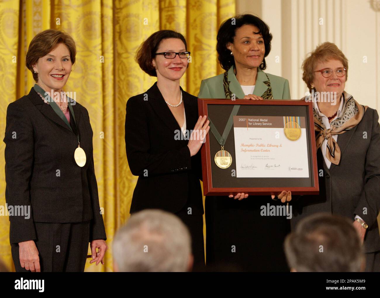 First lady Laura Bush, left, takes part in an awards ceremony with ...