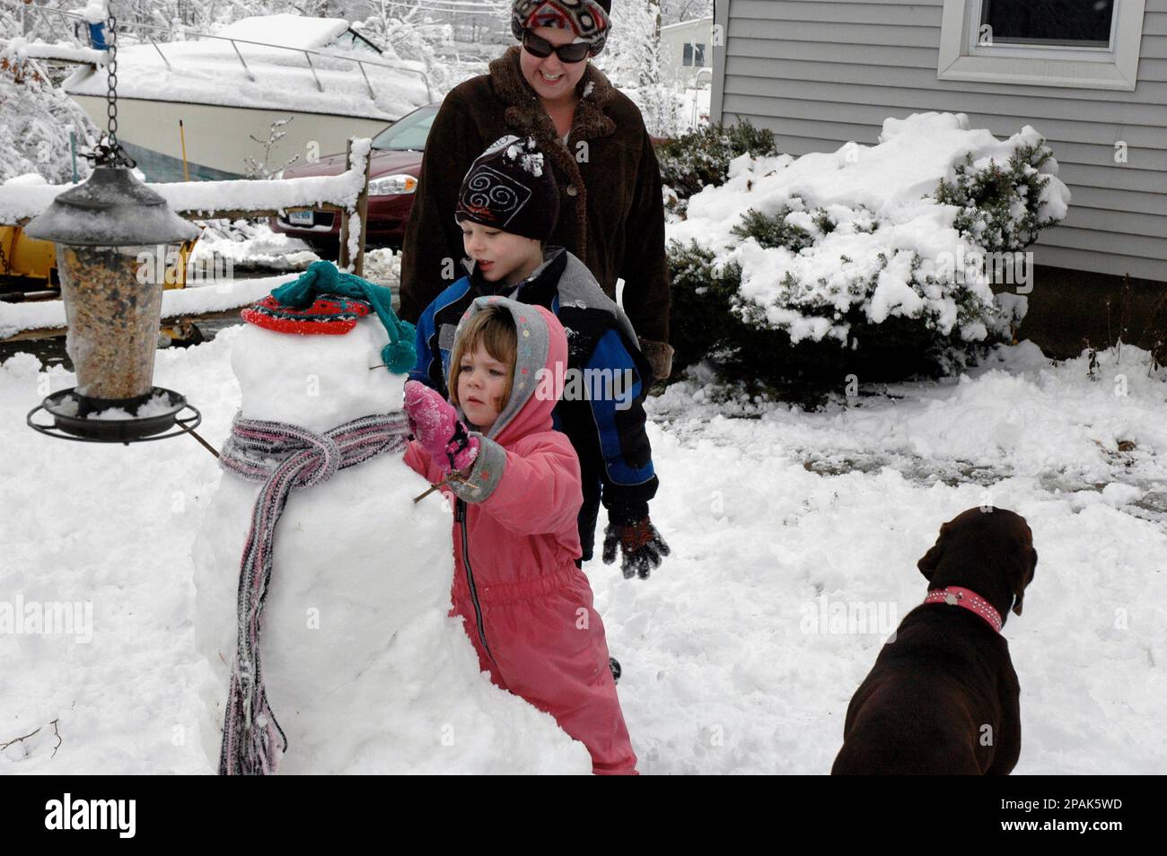 Darcy Hull and her two children, Emily, 4, and Joshua, 7, make a ...