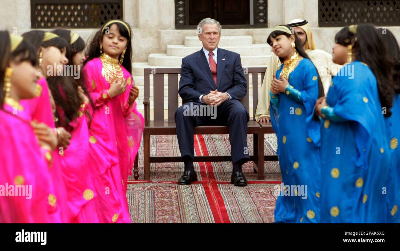 US President George W. Bush, center, watches dancers perform during a ...