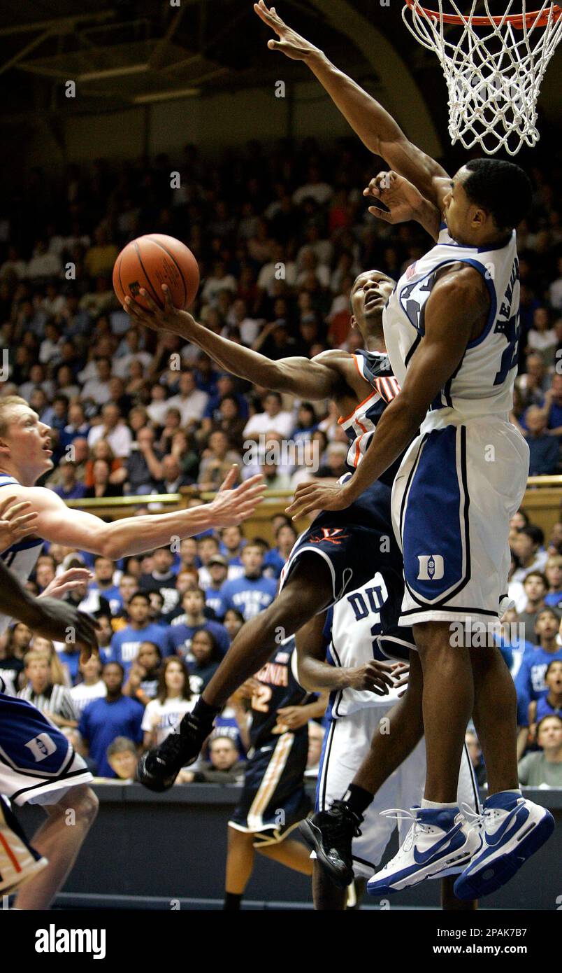 Virginia's Sean Singletary drives to the basket as Duke's Gerald ...