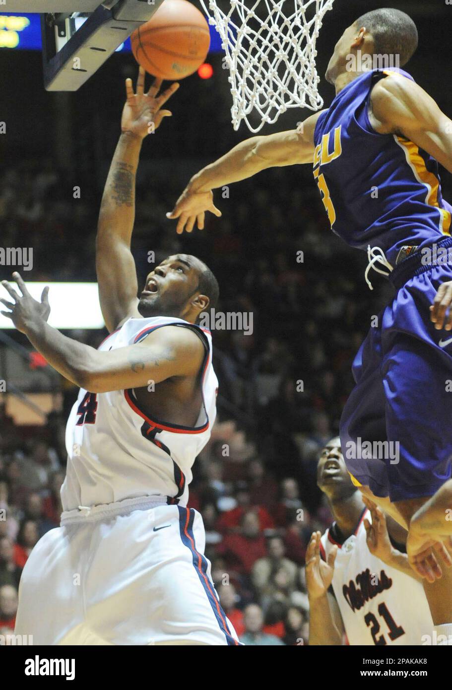Mississippi's Dwayne Curtis, left, shoots as Louisiana State's Anthony ...