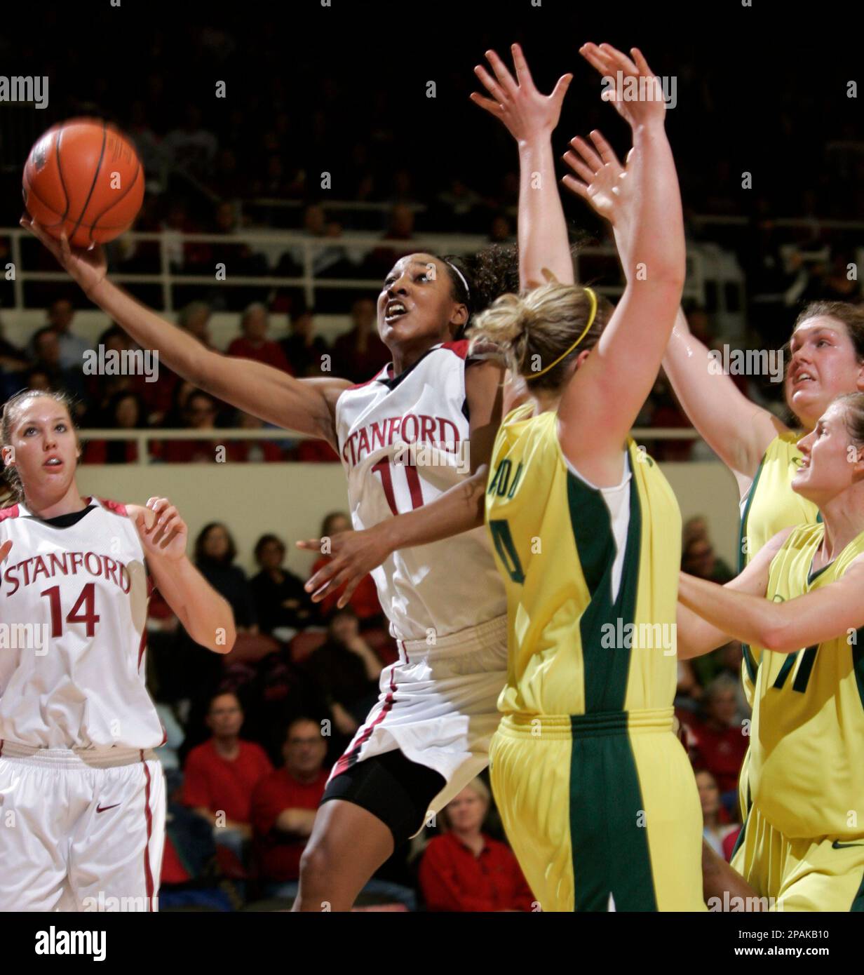 Stanford guard Candice Wiggins (11) scores in front of Oregon forward ...