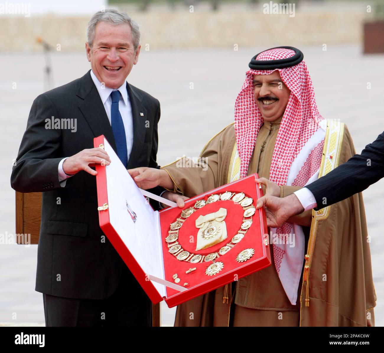 US President George W. Bush, left, is presented with an award by ...