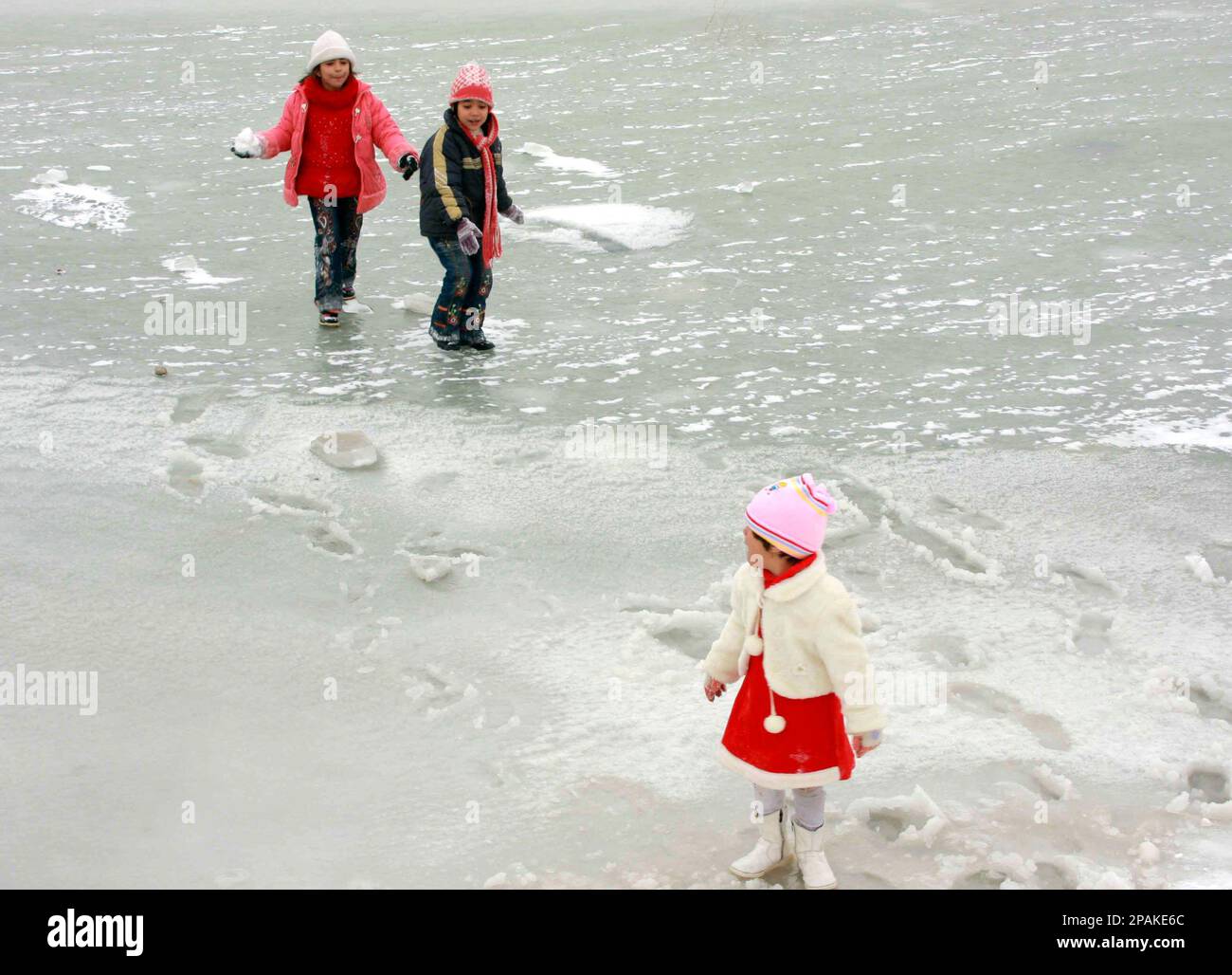 Iraqi girls play in the snow in Sulaimaniyah, 260 kilometers (160 miles ...