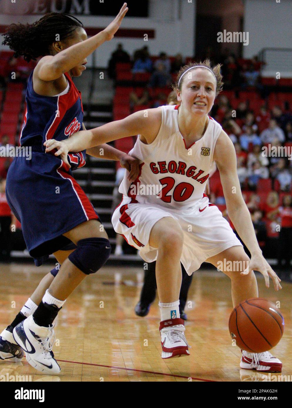 Georgia's Angela Puleo, right, holds off Ole Miss's Kayla Melson, left ...