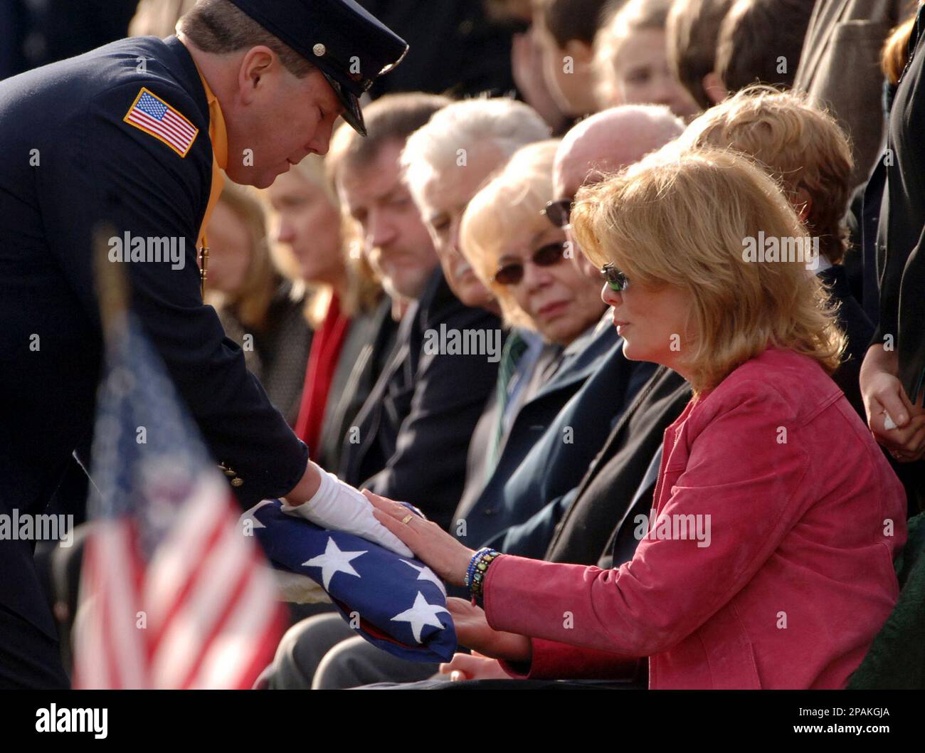 Scranton firefighter Pvt. Joseph Ruddy, left, presents Linda Robeson ...