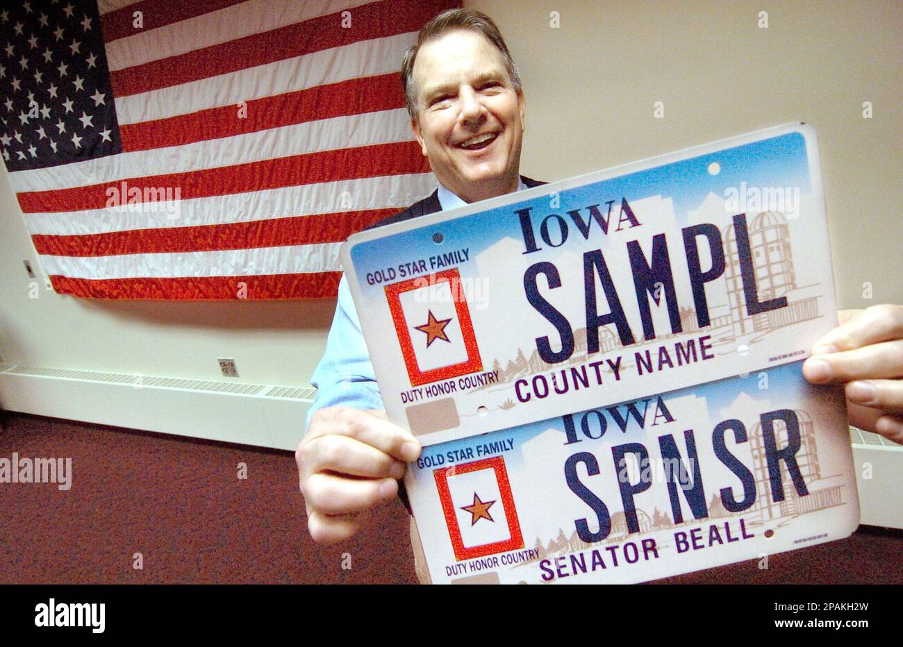 State Sen. Daryl Beall, D-Fort Dodge, holds up samples of the new ...