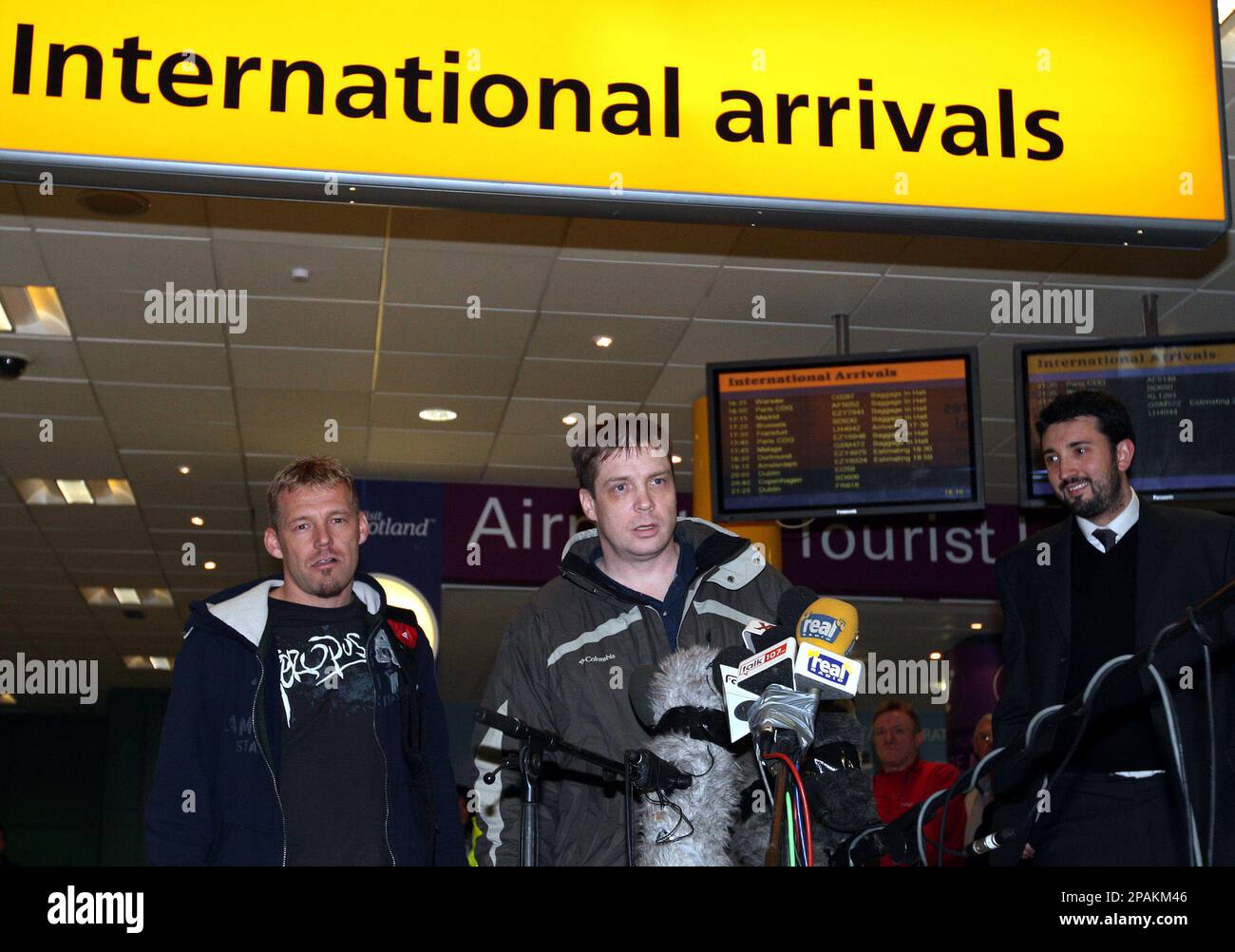 Ken Richey, 43, centre, speaks on his arrival at Edinburgh airport ...