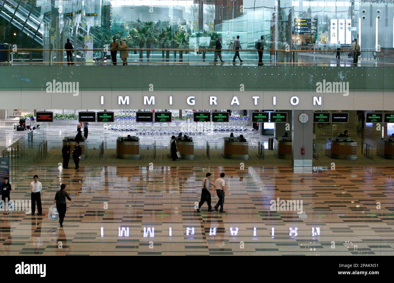 People are seen at the immigration section of the newly completed ...