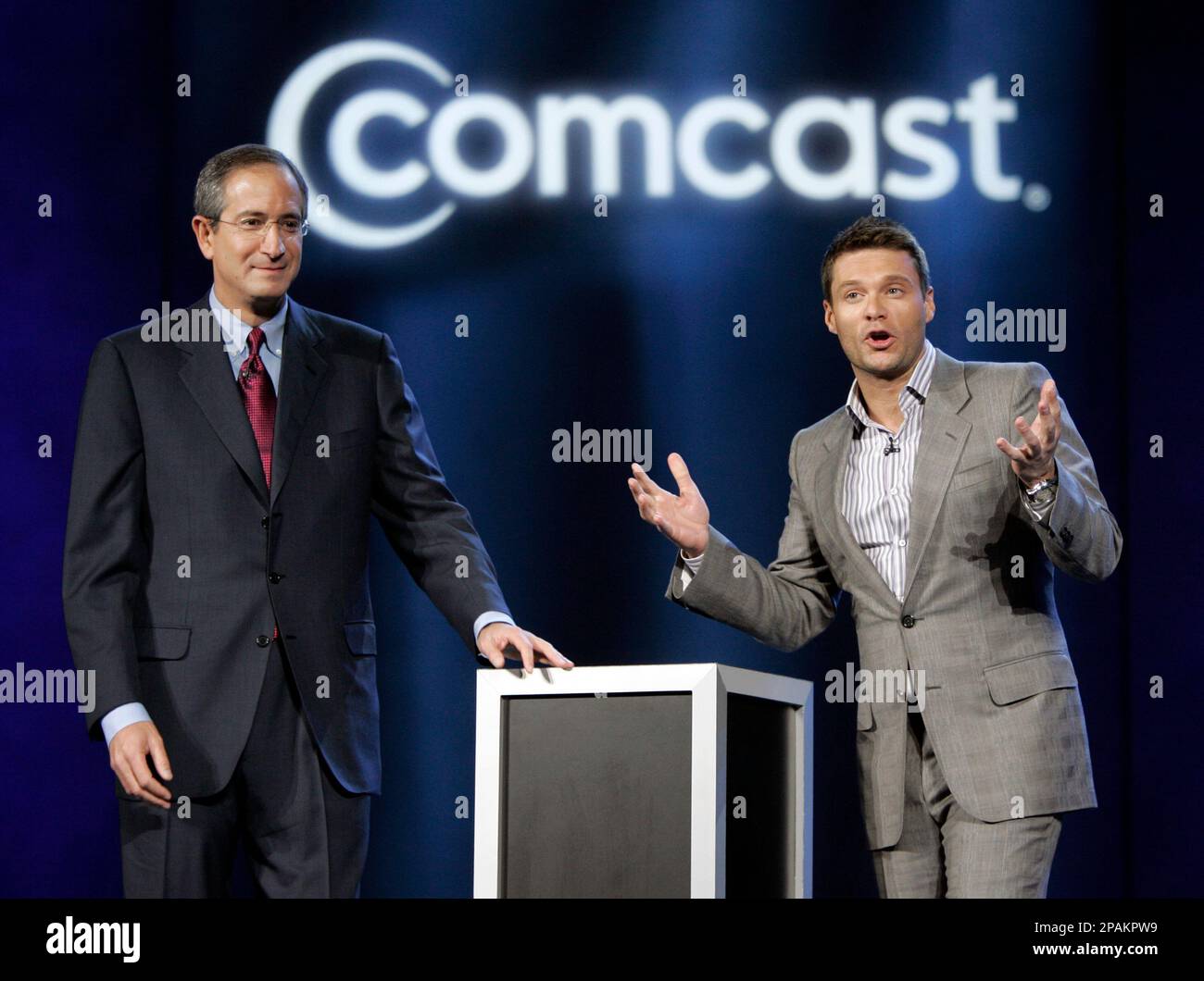 Comcast CEO Brian Roberts, left, and television and radio personality ...