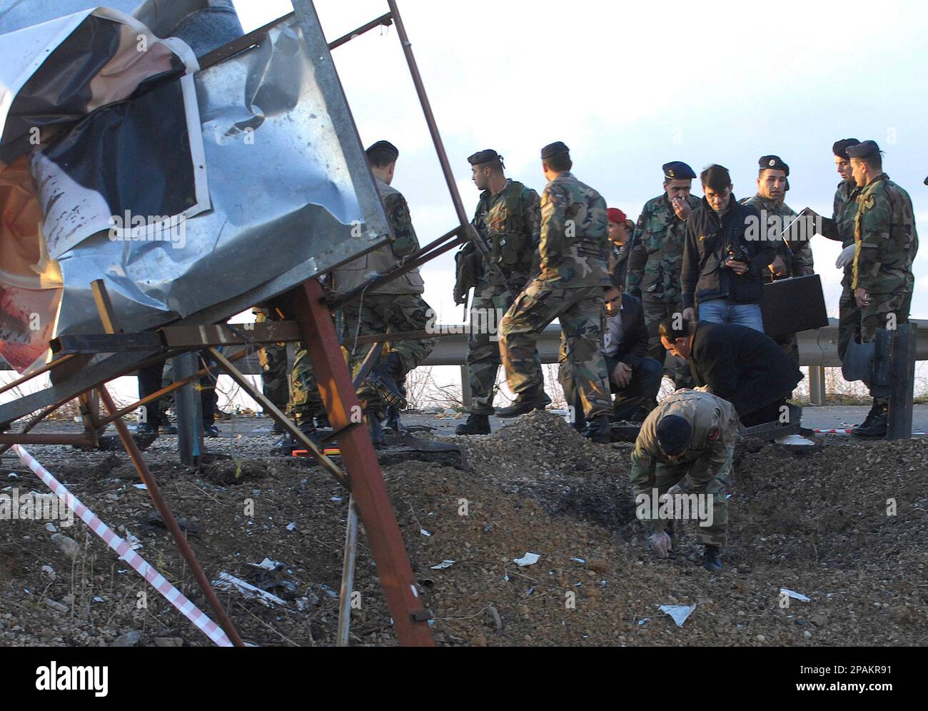 Lebanese army investigators, investigate the scene where a roadside ...