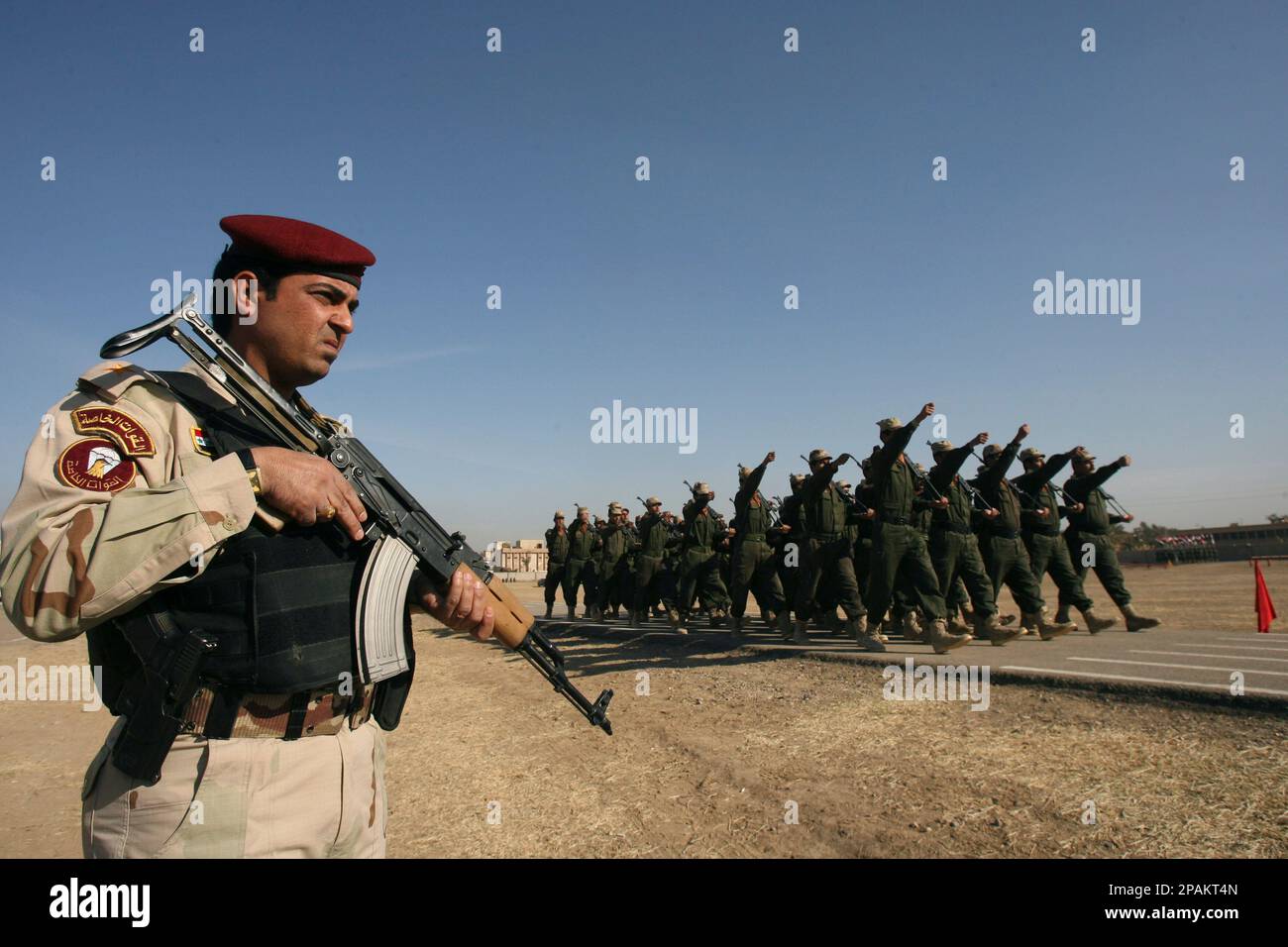 Iraqi National Police cadets march in formation at a graduation ...