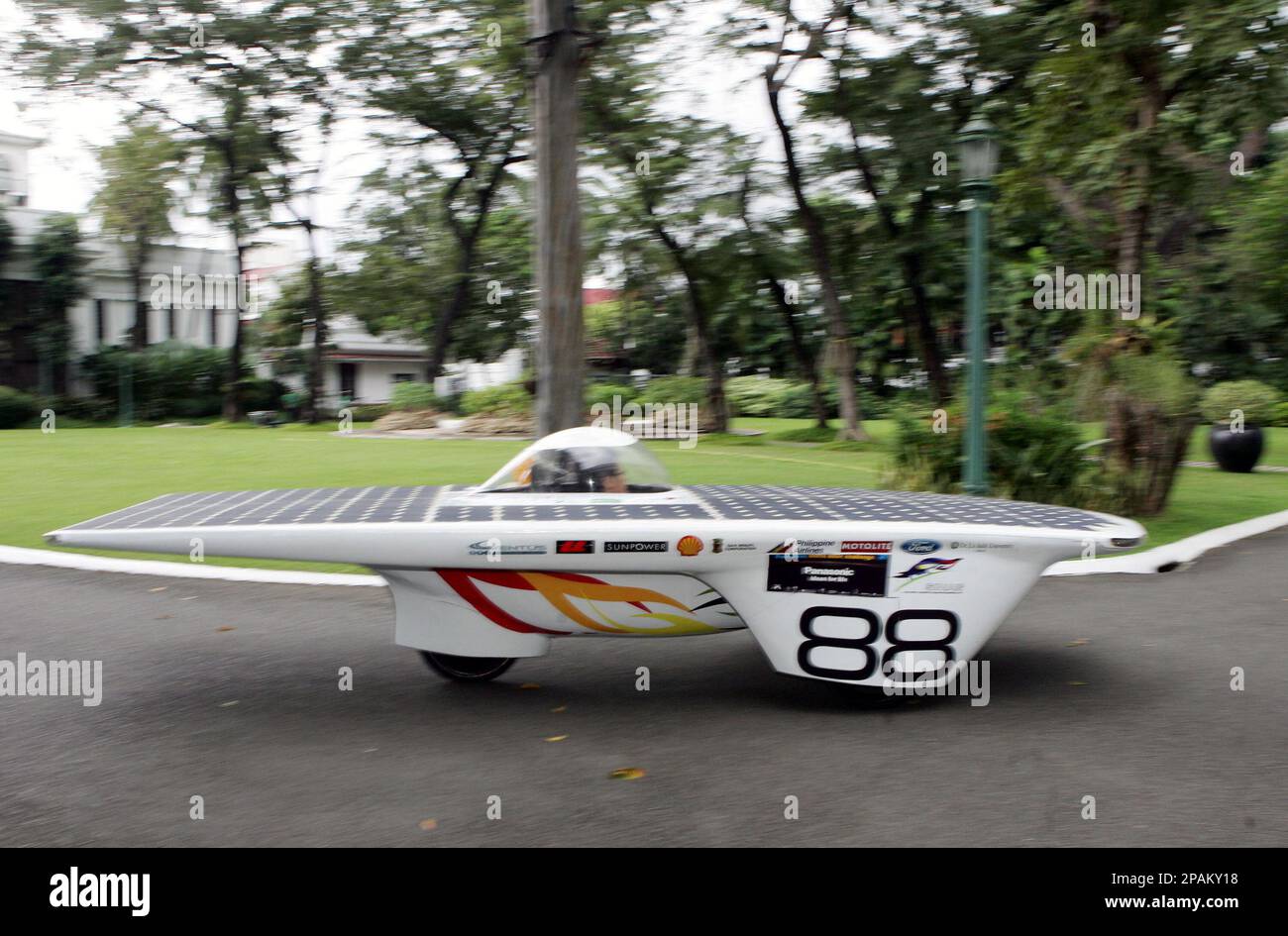 A Philippine-made solar-powered car named "Sinag" is driven around the ...
