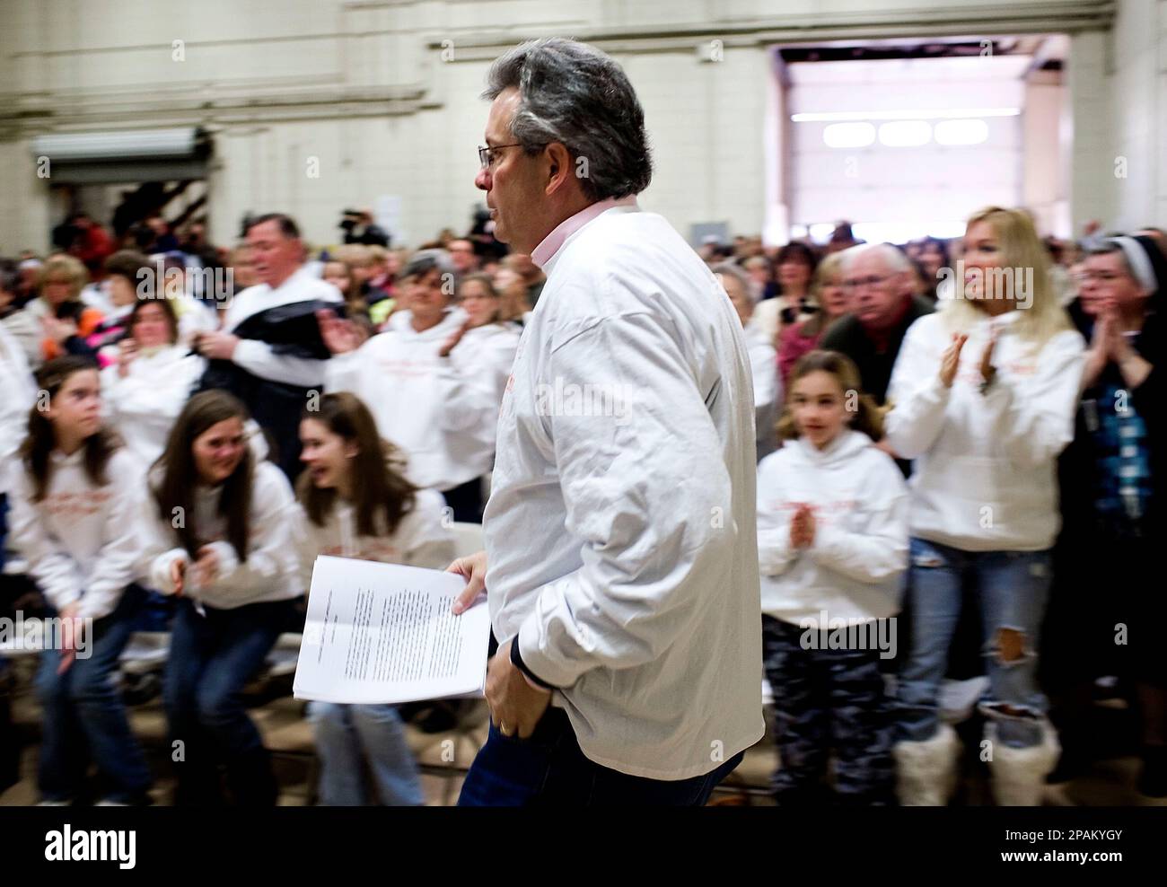 Dr. William Petit takes the stage to a standing ovation at a gathering ...