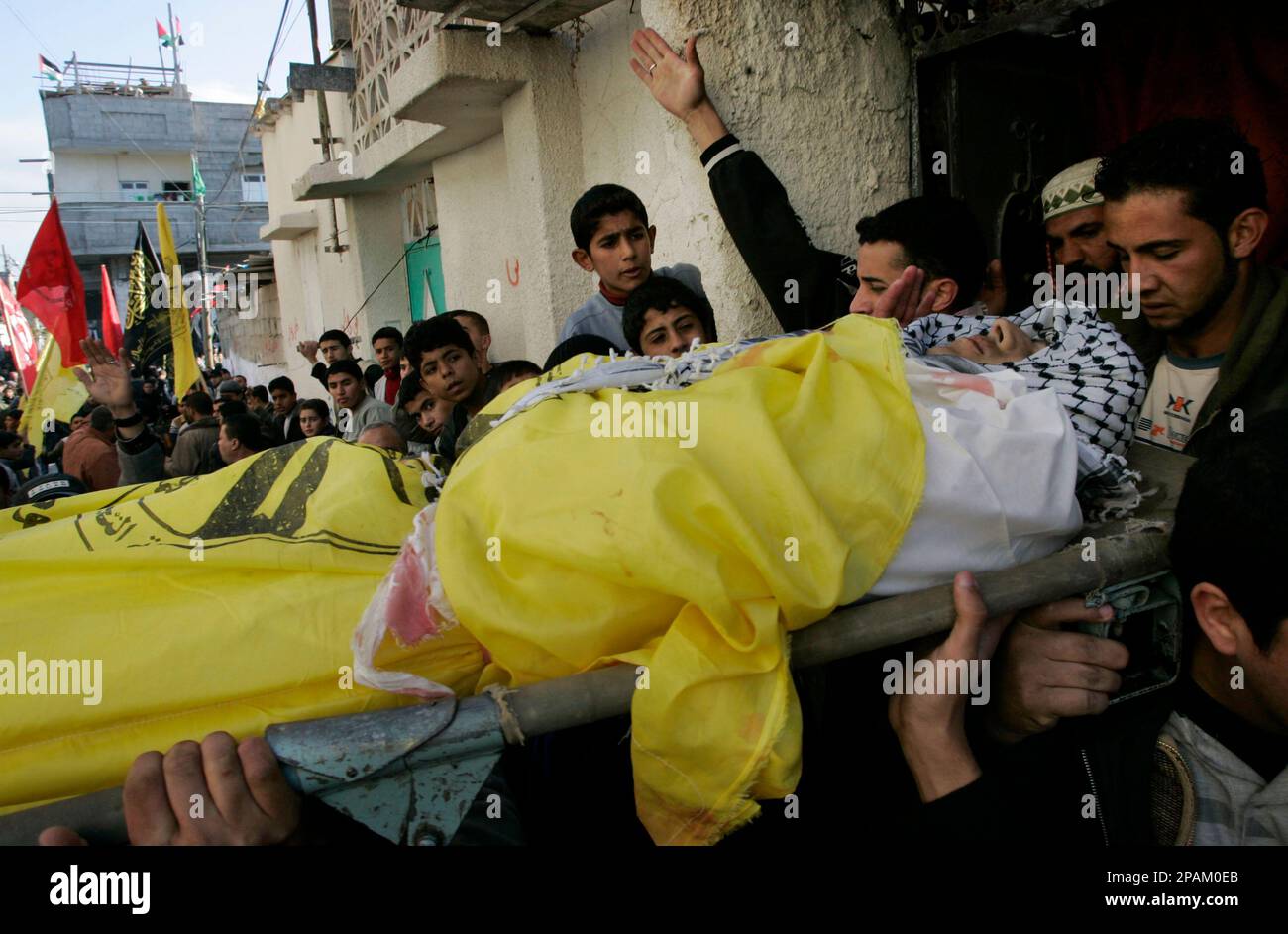 Palestinian mourners carry the body of Zayed Abu Rukba, killed during ...