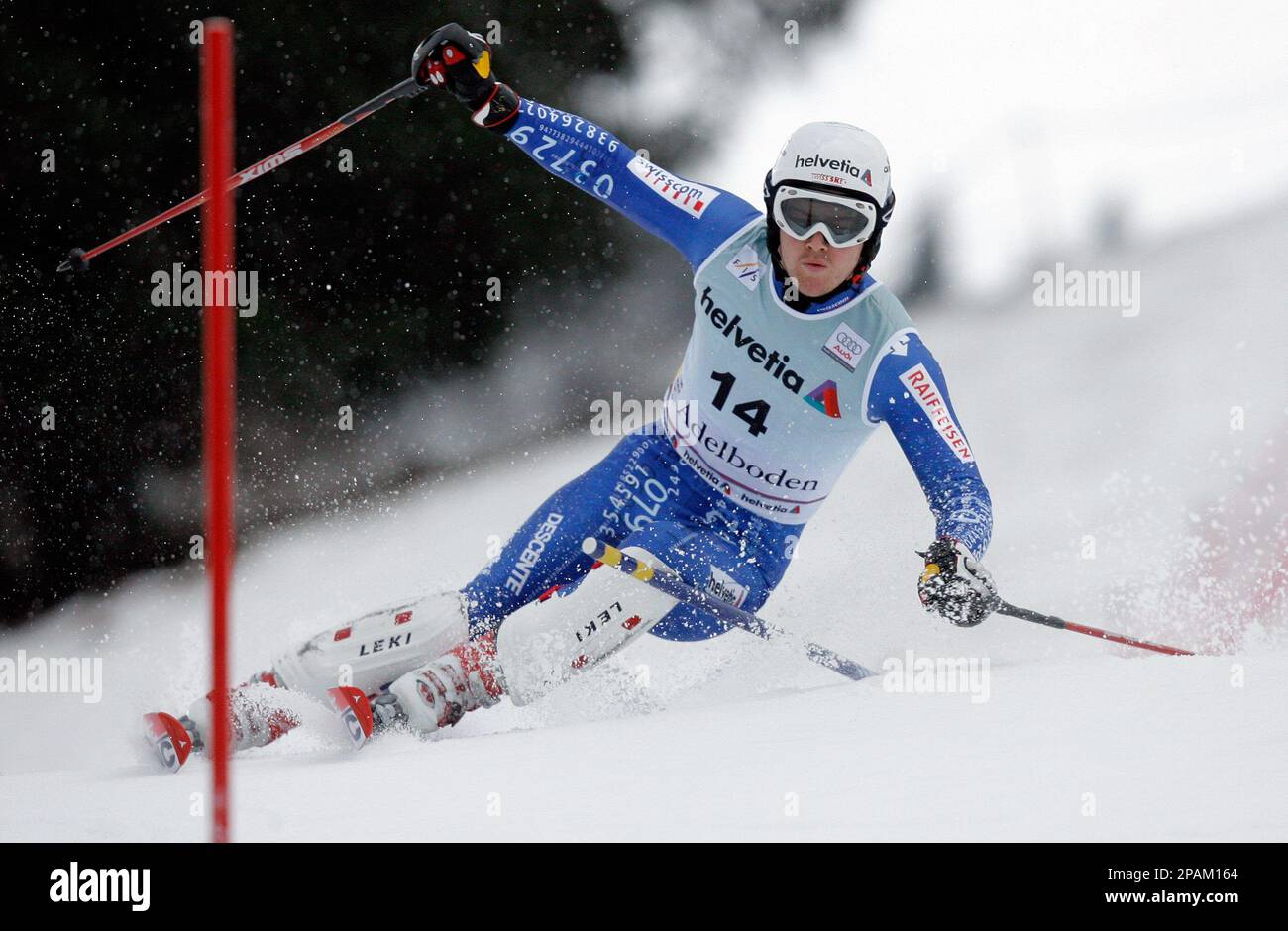 Swiss ski racer Marc Berthod clears a gate in the first run of the men ...