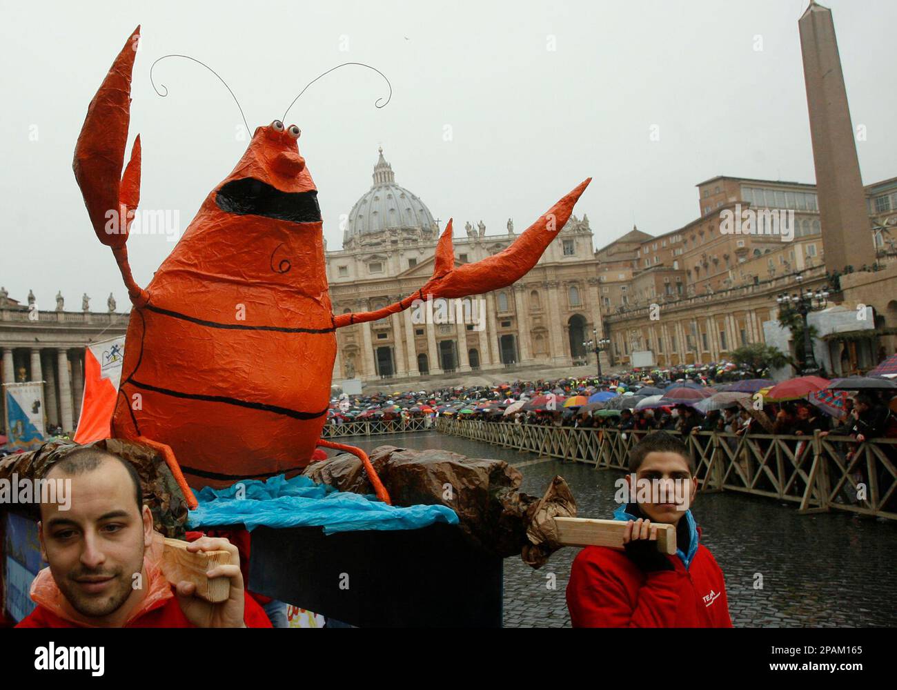 Members of a prawn protection association carry a mock crayfish during ...