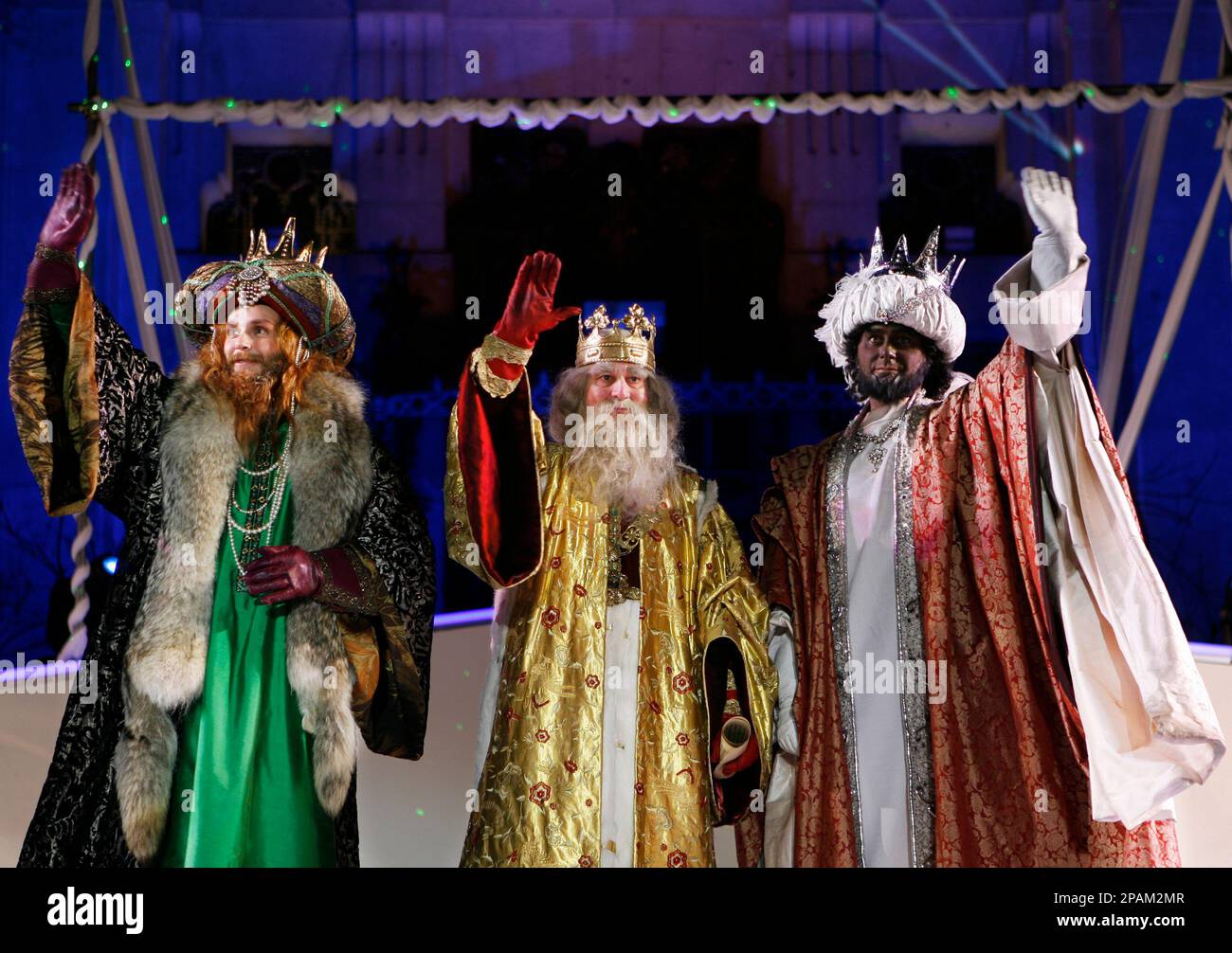 Three man dressed up as the Three Wise Men, wave to the public during ...