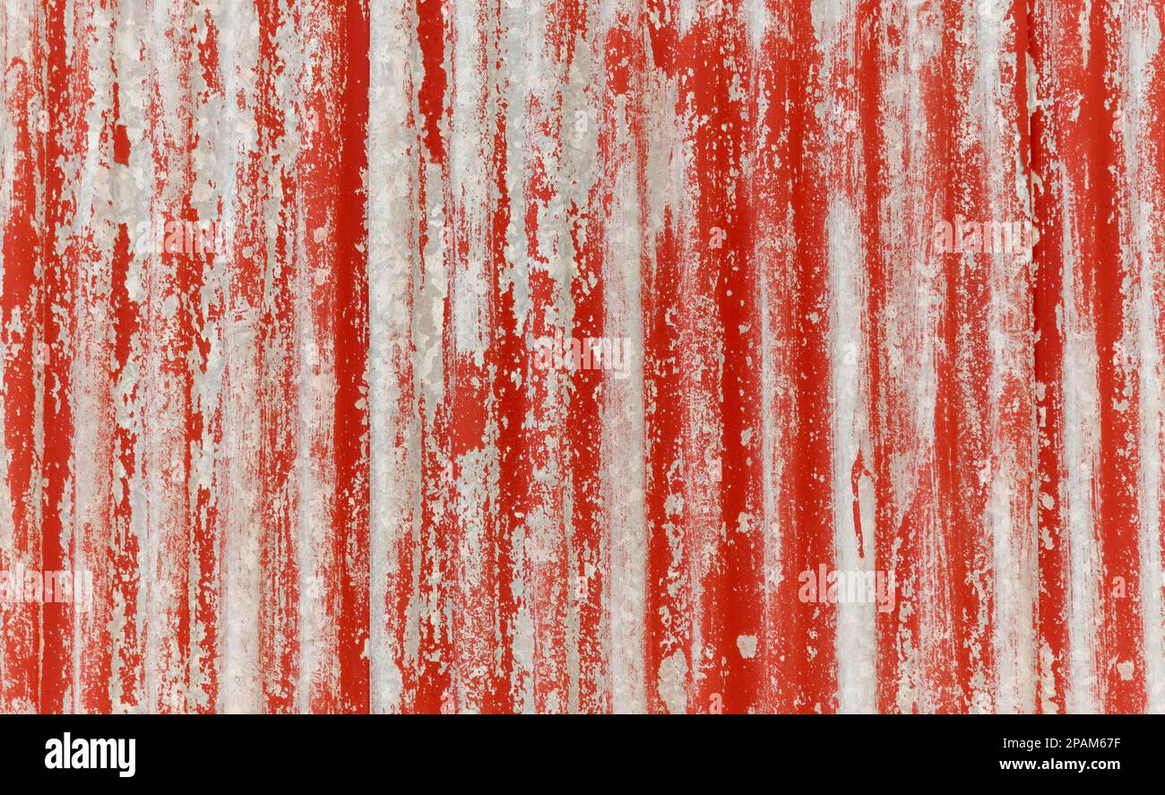 Red painted weathered corrugated sheets for a background, texture ...