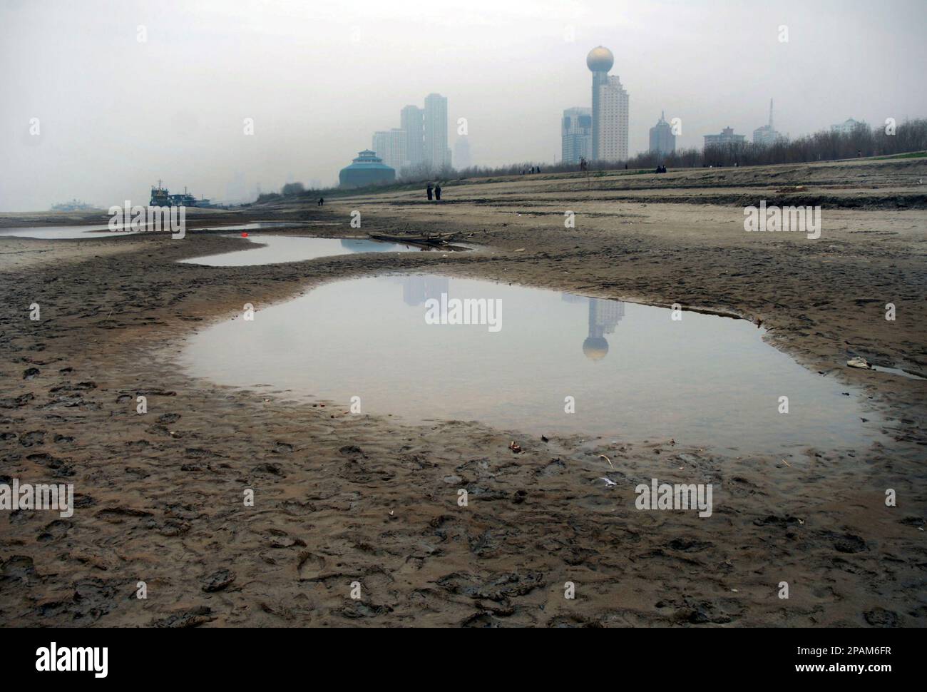 A river bed is exposed as water levels fall along the Yangtze River ...