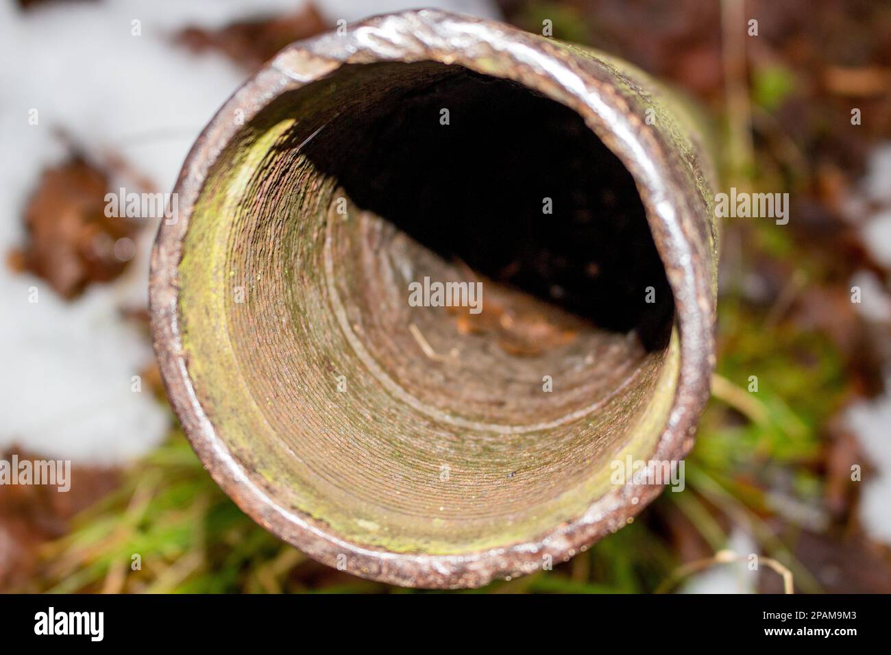 An old drill pipe sticking out of the ground Stock Photo - Alamy