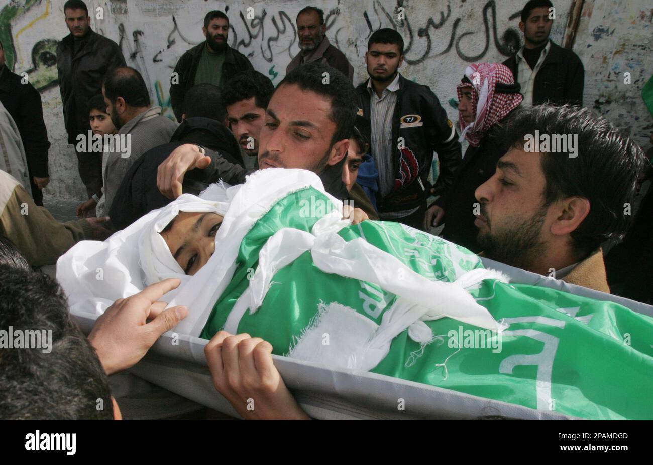 Palestinians carry the body of 14 years old Mohammed Abu AL-Wafa during ...