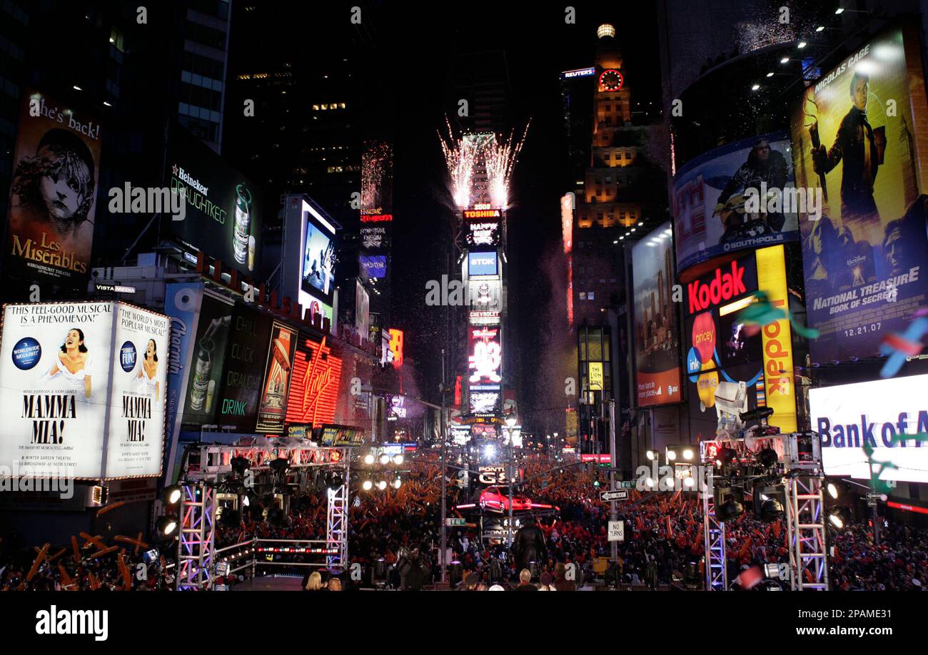 Fireworks erupt from a building at the stroke of midnight during the ...