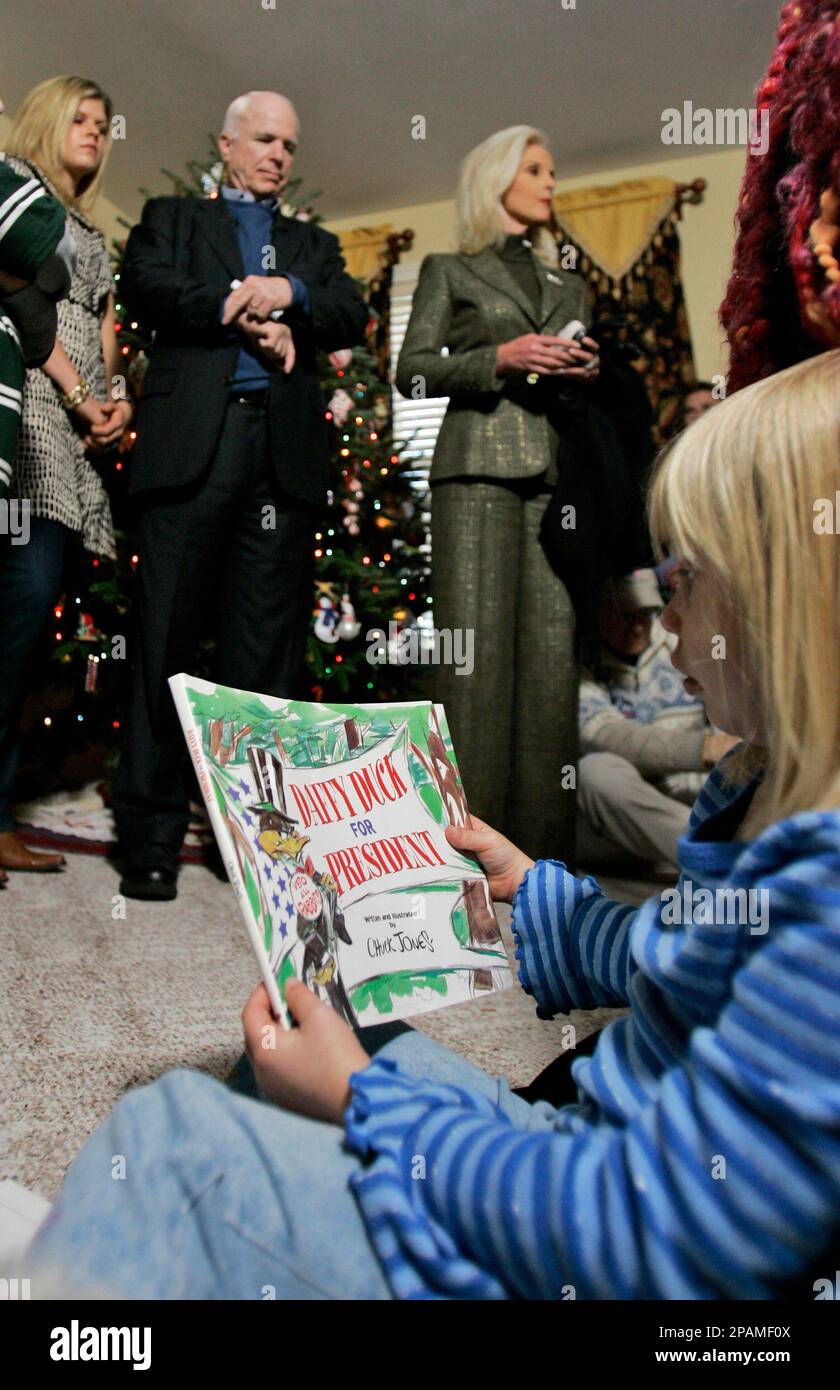 Allison Iaconis, 4, looks at the cover of a book while Presidential ...