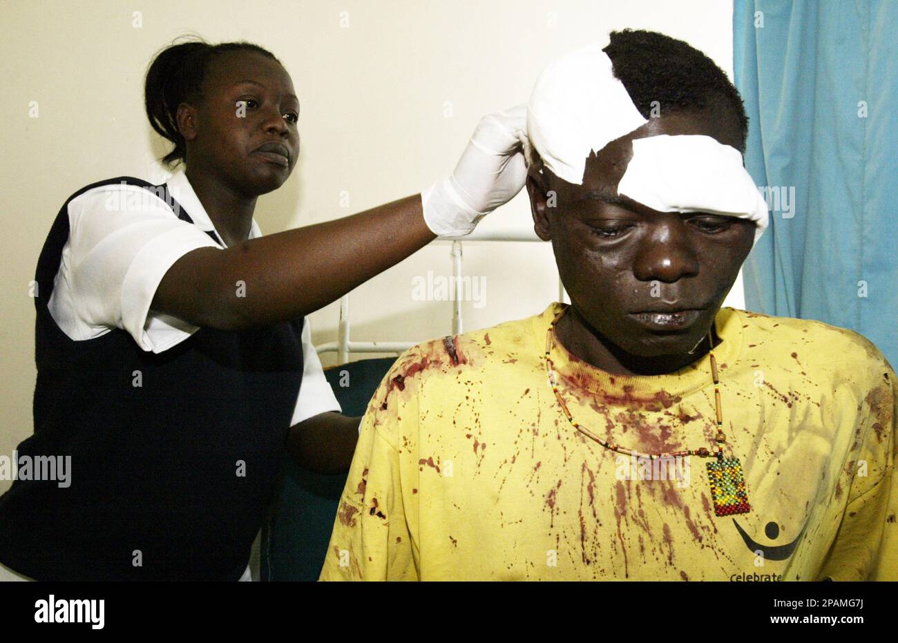 A Nurse attends to Jacob Ochieng, 20 years, in Masaba Hospital,Nairobi ...