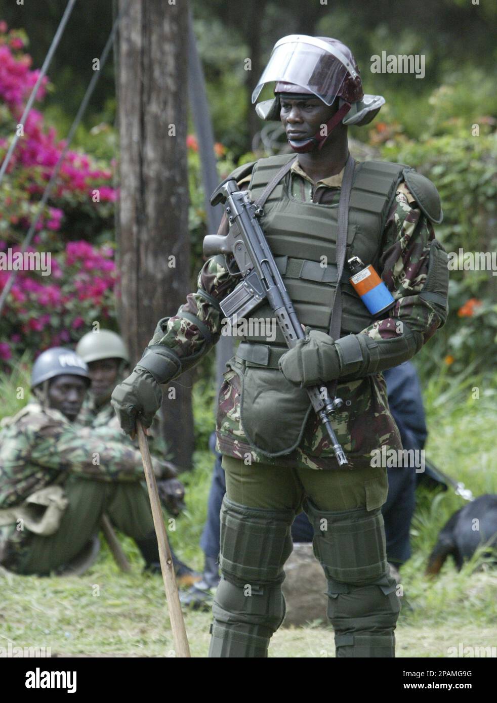 A Kenyan riot police officer stand guard at the Uhuru Park in the city ...