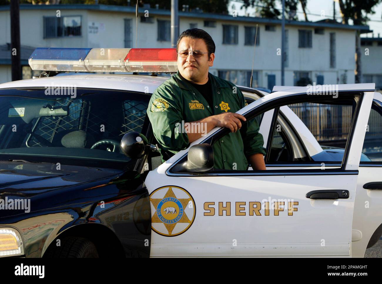 Los Angeles County Sheriff's gang detective Adam Torres looks towards ...