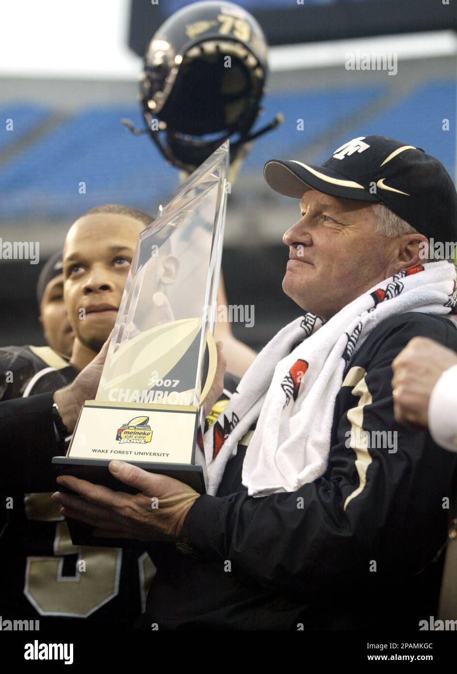 Wake Forest head coach Jim Grobe, right, and safety Aaron Mason hold ...