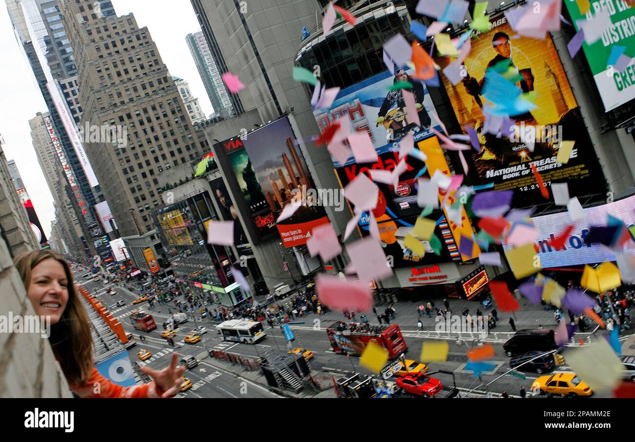 Lori Raimondo, of the Times Square Alliance, tosses confetti during an ...