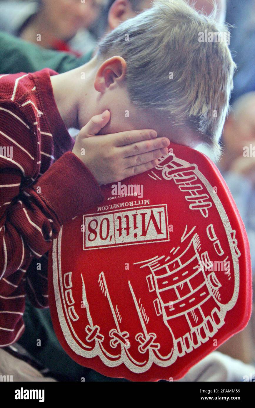 Wesley Magnell, 6, hides his face during a speech by Republican ...