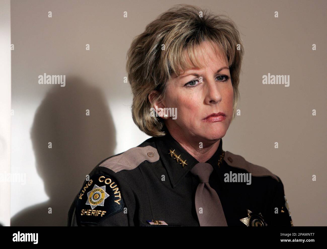 King County Sheriff Sue Rahr looks on as Prosecutor Dan Satterberg ...