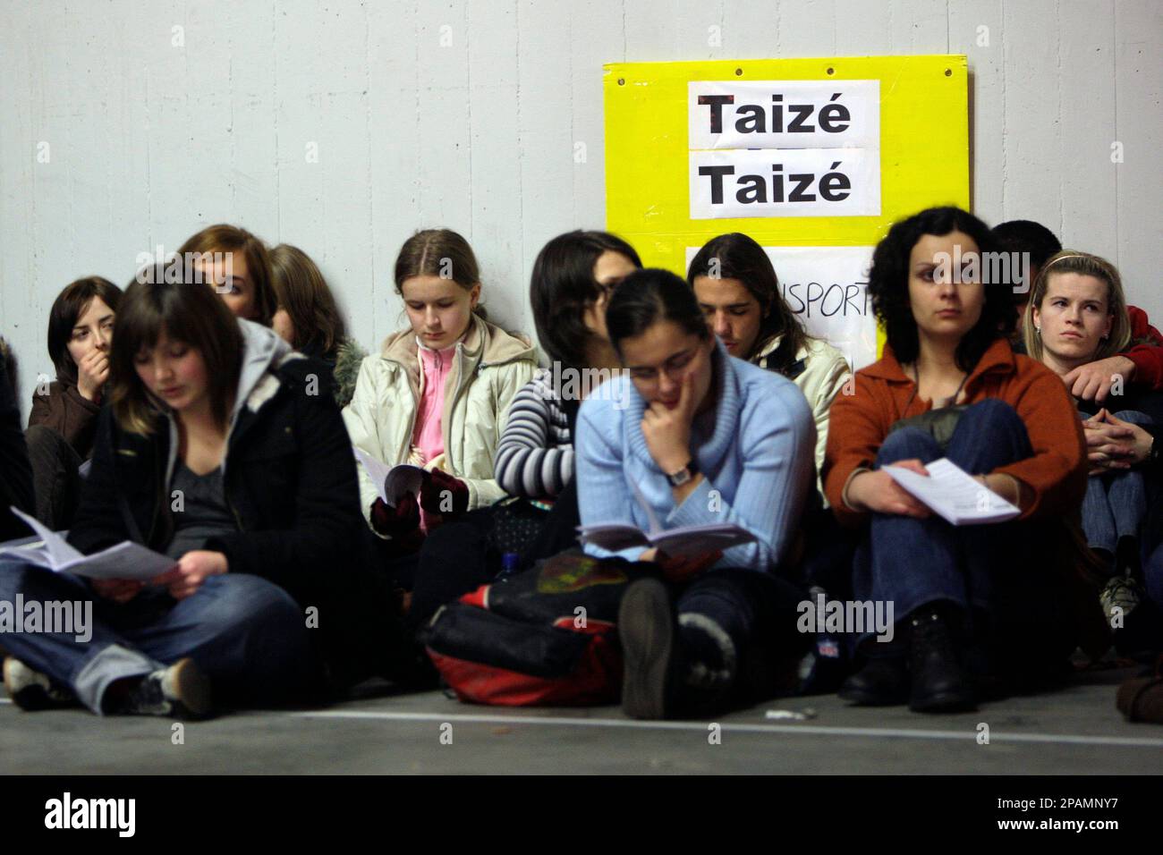 Members of the ecumenical community Taize wait for the start of a late ...