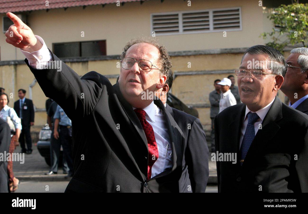 Cambodian Prime Minister Hun Sen listens Dr. Beart Richner, left, of Kuntha Bopha Hospital's ...