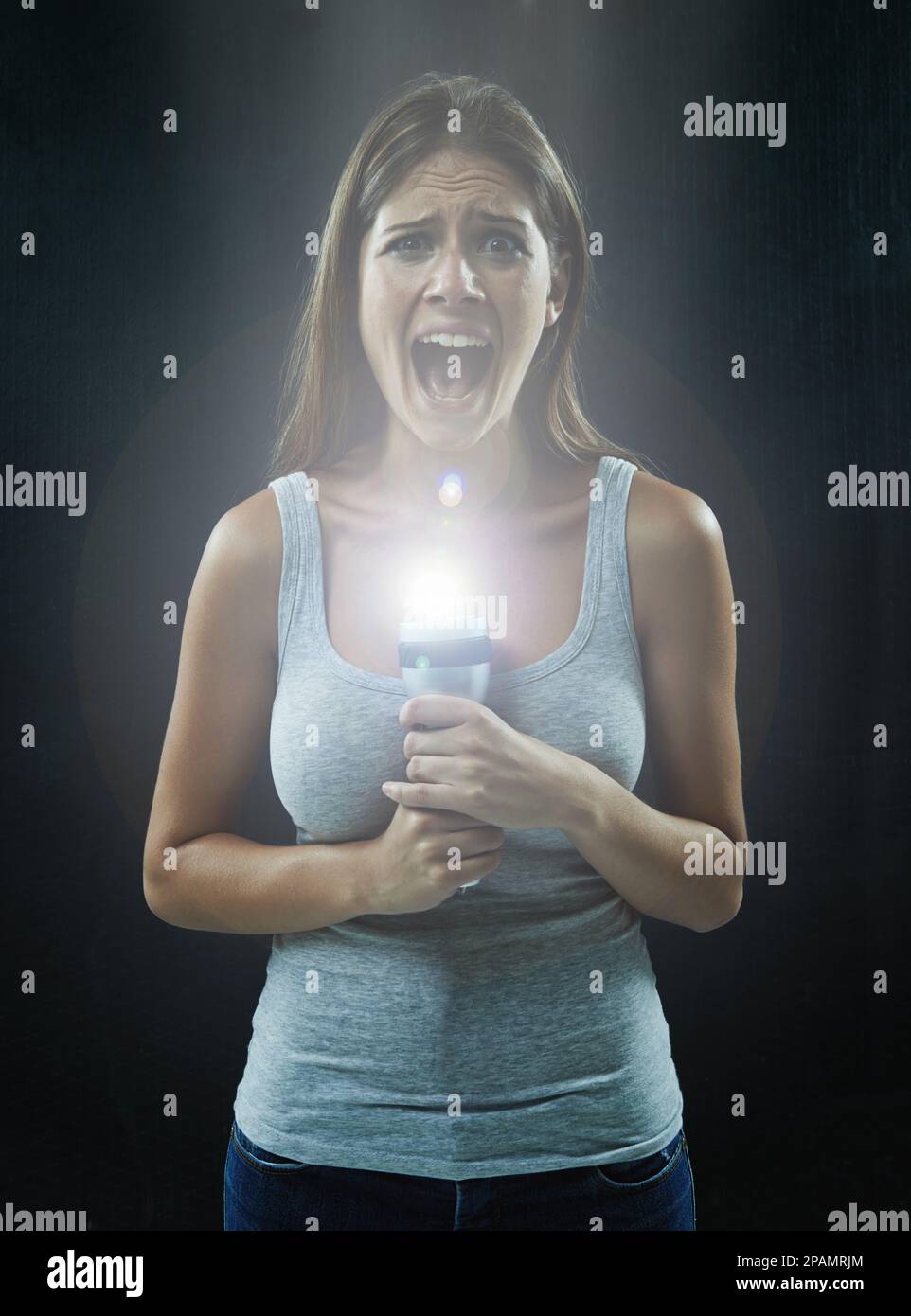 Horror movies have made her paranoid about the dark. A young brunette ...