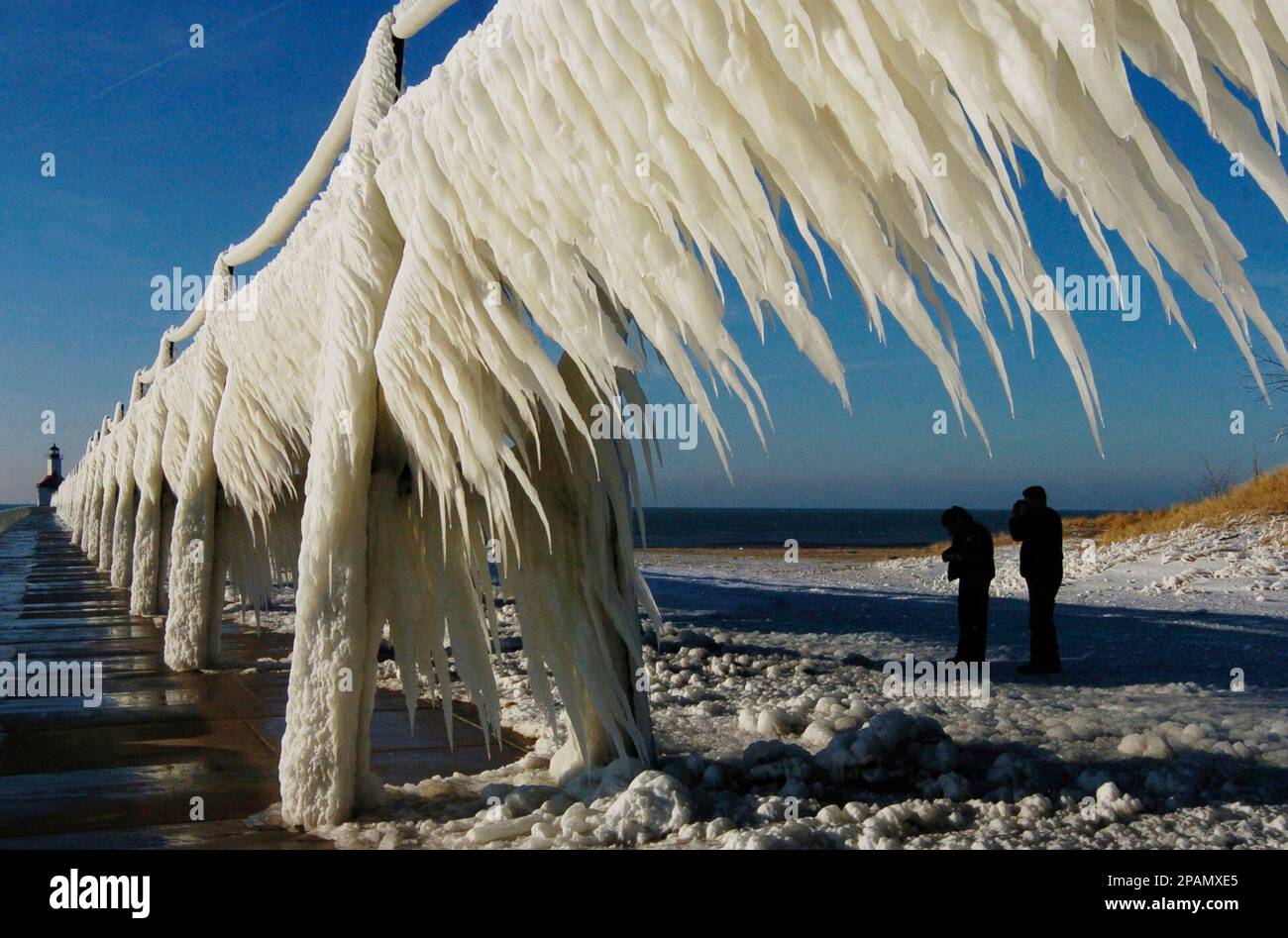 Layers of ice coat the North Pier of the St. Joseph Lighthouse Tuesday ...