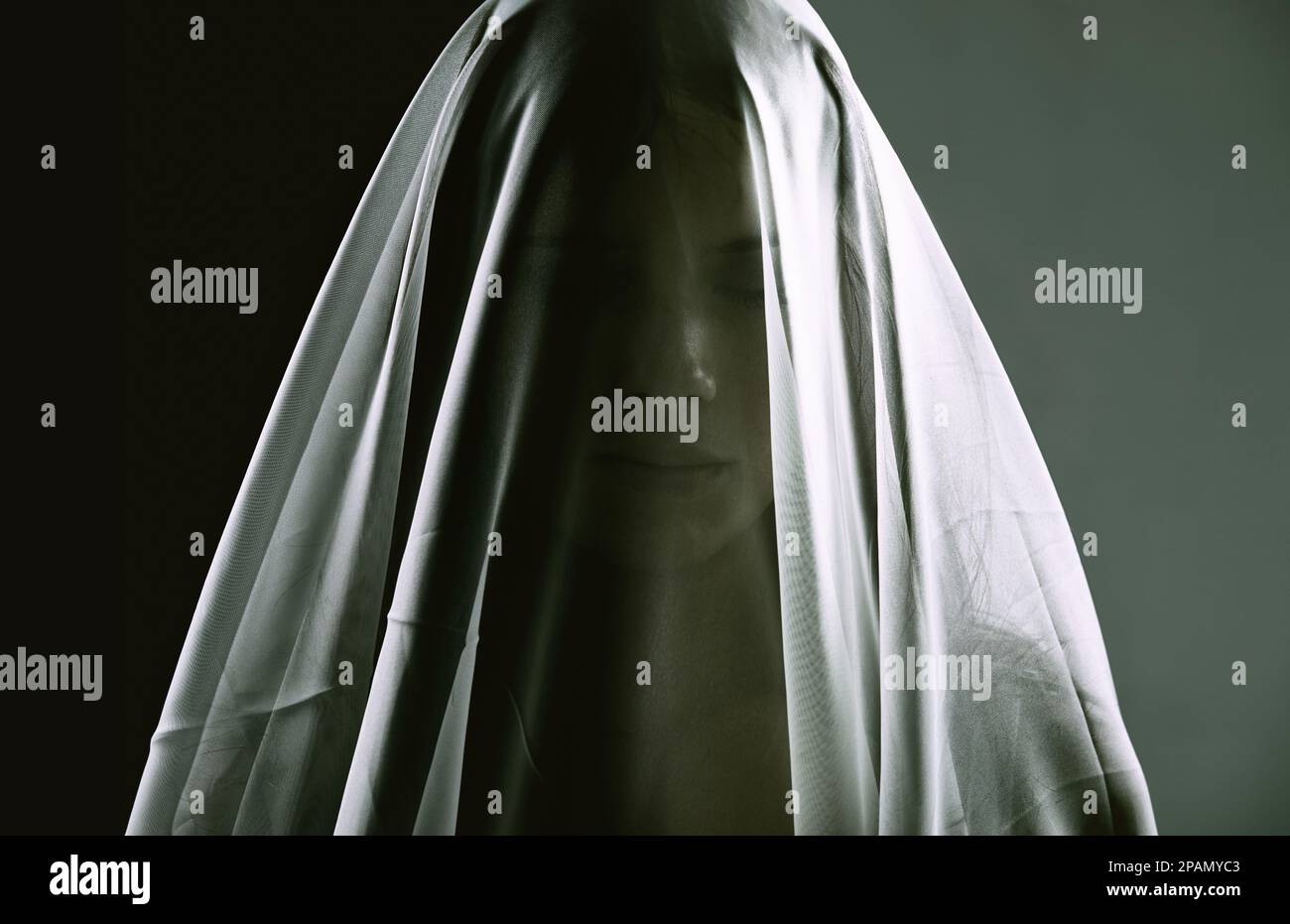 Shes here...A ghostly apparition of a woman isolated on a black ...