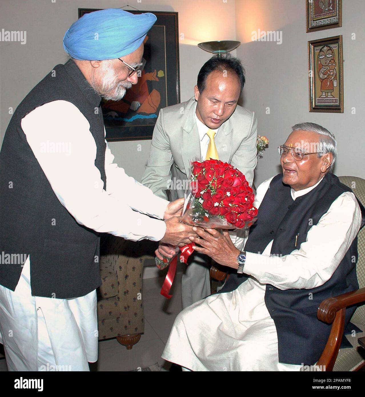 Indian Prime Minister Manmohan Singh greets former Prime Minister Atal ...