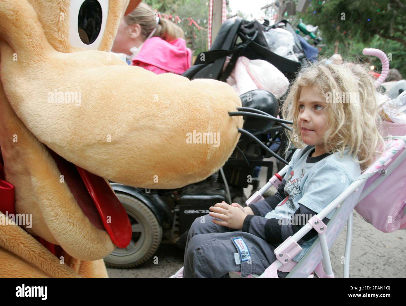 Oliver Booth, 4, looks over a character at Disneyland in Anaheim, Calif ...